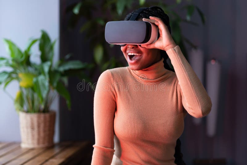African Woman in Vr Headset Feel Excited Looking at Objects of Virtual ...