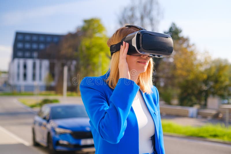 Woman with VR Virtual Reality Goggles Experiences a Metaverse World ...