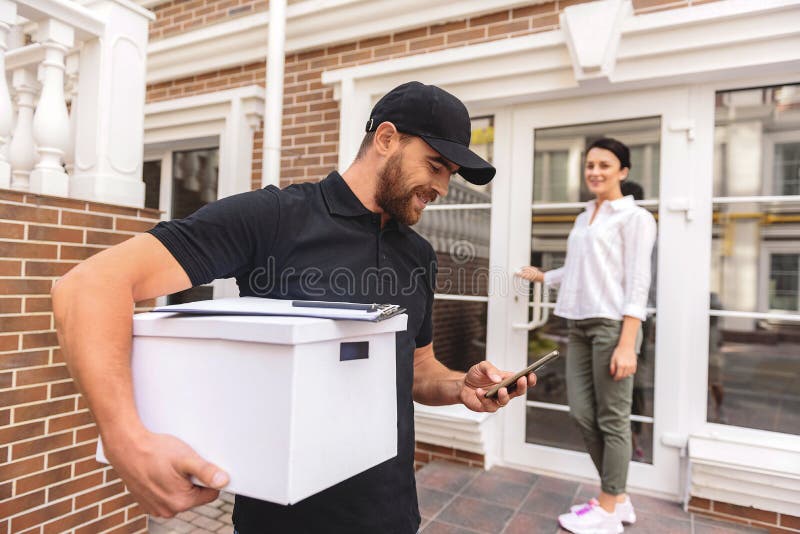 Happy Postman With Package Waiting For Customer Stock Image - Image of ...
