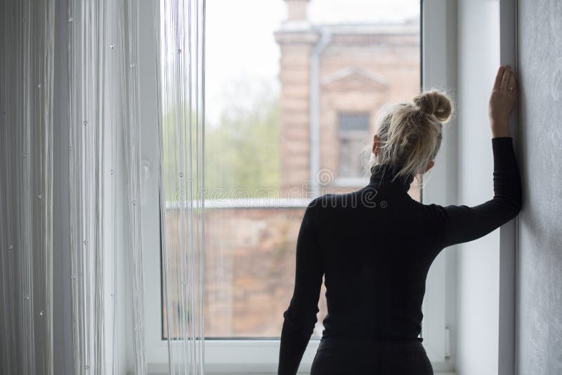 Woman Waiting and Looking Out the Window Stock Photo - Image of ...