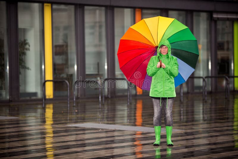 Woman Waiting in the Rain with Her Rain Cloth Stock Image - Image of ...