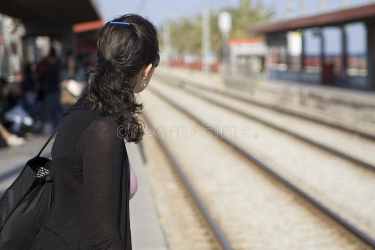 Woman waiting for train stock photo. Image of destination - 14012994