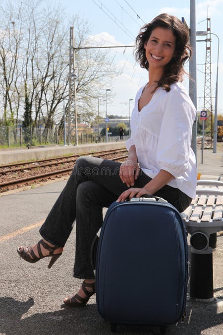 Woman Waiting at Train Station Stock Photo - Image of female, brown ...