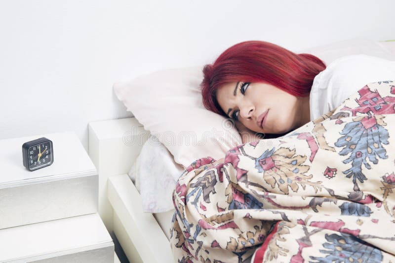 Woman Waking Up, Lying on the Bed Awake. Stock Photo - Image of bedroom ...