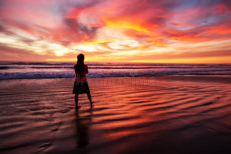 Woman Walking Alone On The Beach In The Sunset Stock Image Image Of
