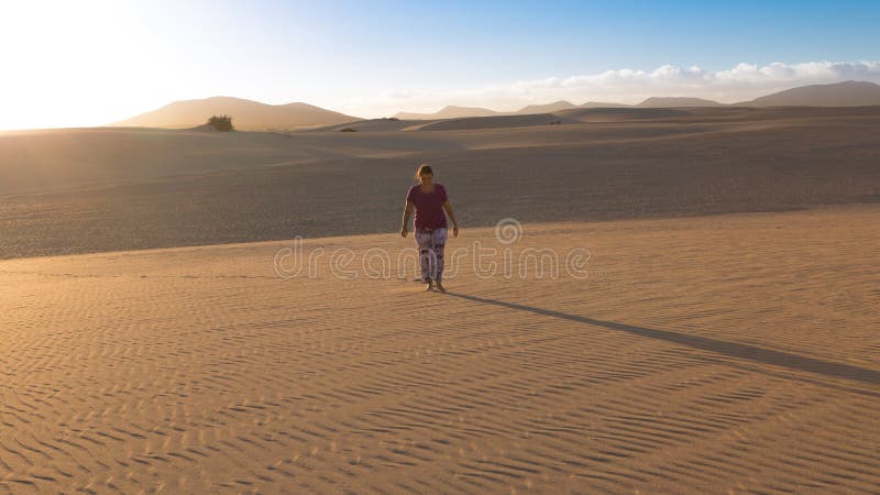Woman Walking Alone in the Desert Stock Image - Image of lonely, feel ...