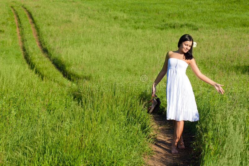 Woman Walking Along the Road Stock Image - Image of caucasian, field ...