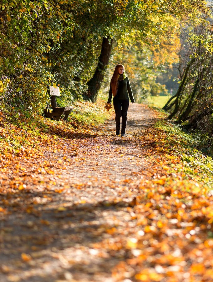 Young Woman Walking in Park Stock Image - Image of walking, tree: 6853281