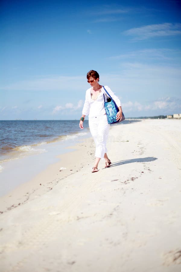 Woman Walking the Beach stock photo. Image of fresh, beauty - 22743770