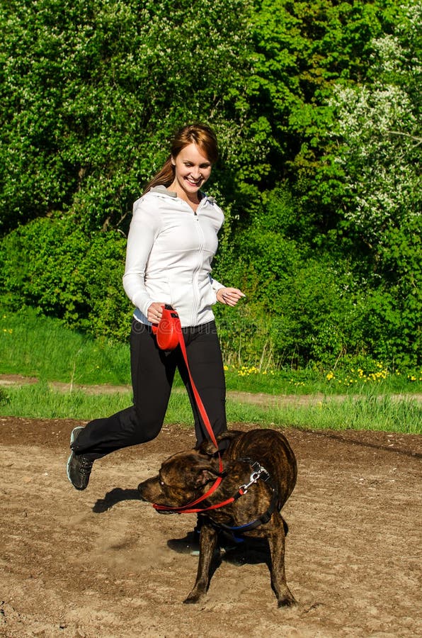 Woman walking with dog stock photo. Image of nature, friendship - 25085788