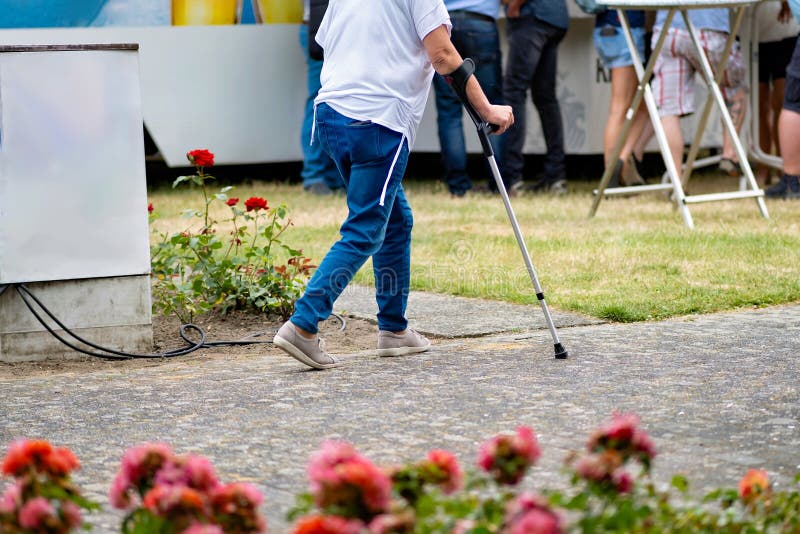Woman Walking Down Path with Walking Stick in Germany Stock Image ...