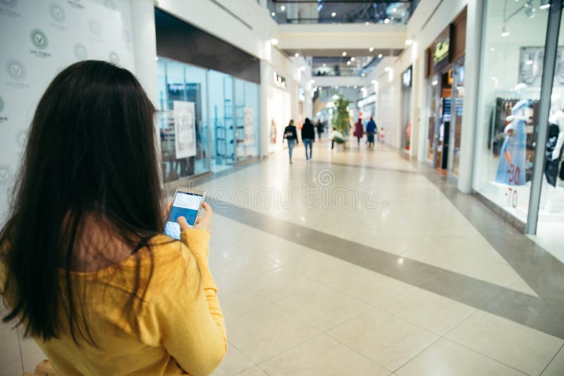 Woman Walking by Mall and Check Her Phone Stock Image - Image of share ...