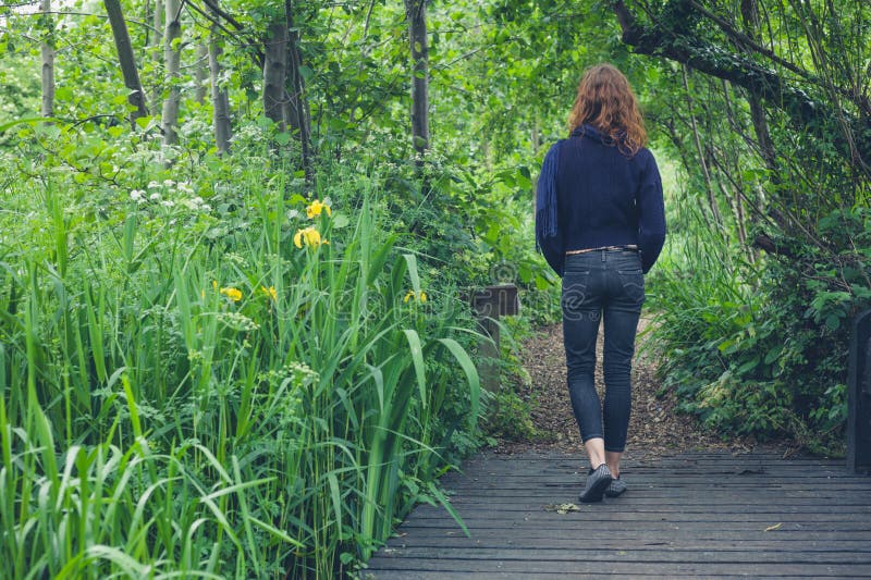 Woman Walking on Path in Forest Stock Image - Image of tree, fashion ...