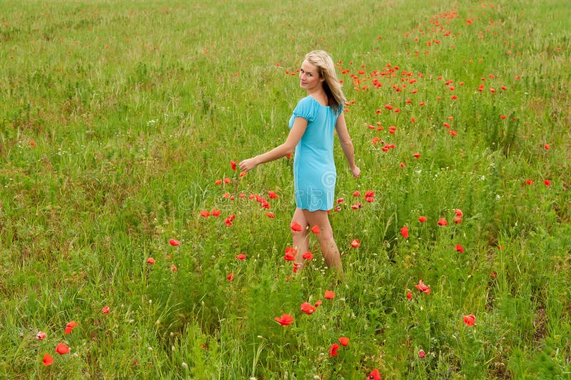 Woman Walking in Poppy Field Stock Photo - Image of poppies, papaver ...