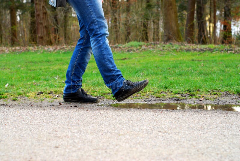 Stepping into puddle stock photo. Image of walkway, human - 3498834