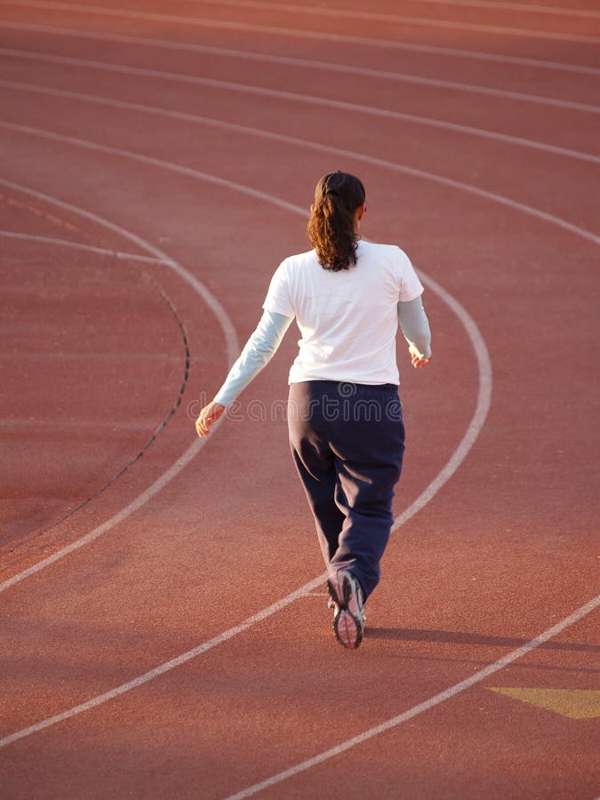 Woman Walking On Track Royalty Free Stock Image - Image: 3316576