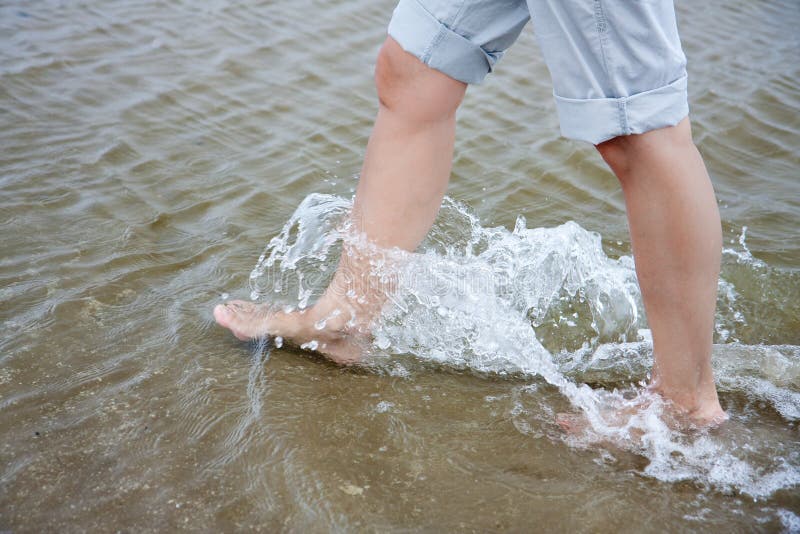 Girl Walking In Shallow Water Stock Photo - Image of dance, lagoon ...