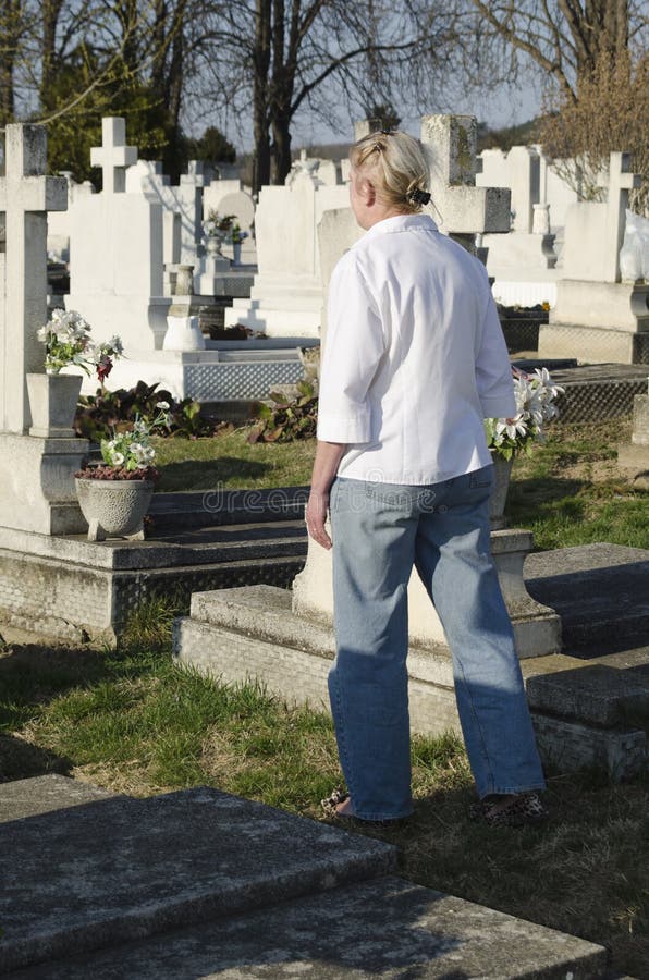 Woman Walks through an Cemetery Stock Image - Image of dead, religious ...