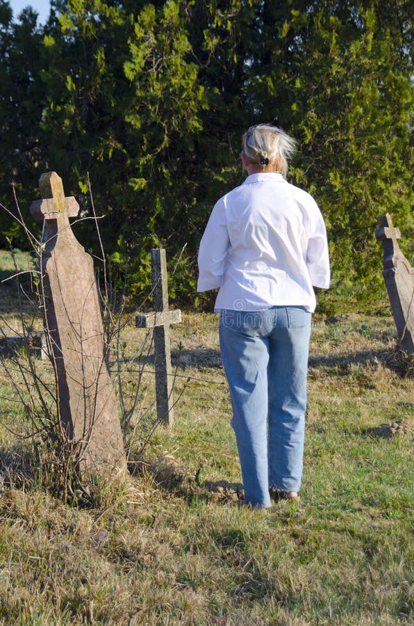 Woman Walks through an Old Cemetery Stock Photo - Image of symbol ...