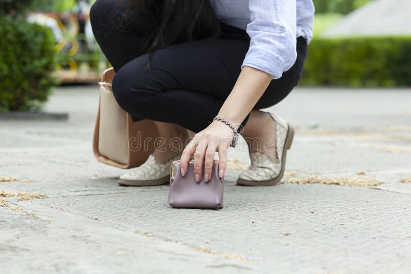Woman and a Wallet on the Ground Stock Photo - Image of footpath ...