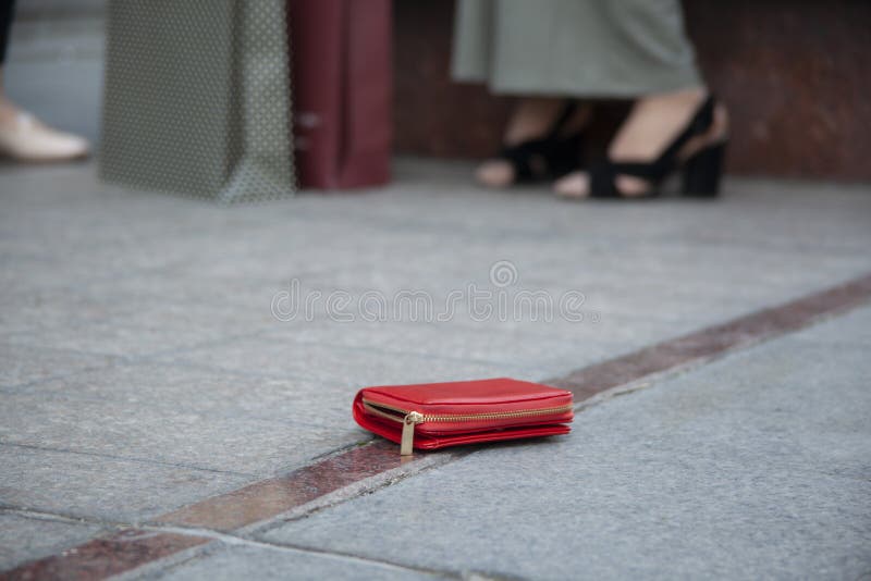 Woman and a Wallet on the Ground in Street. Stock Photo - Image of male ...