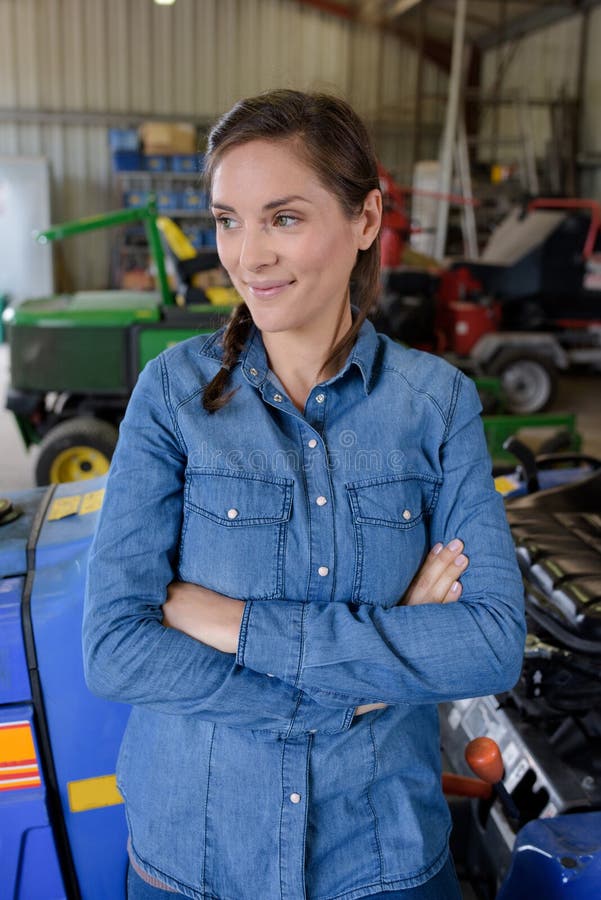 Woman in warehouse stock image. Image of proud, garage - 174010001