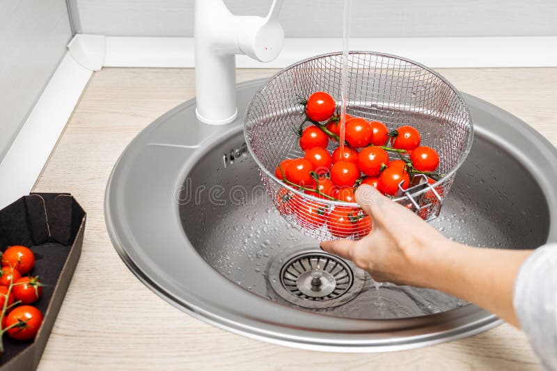 Woman Washing Tomatoes in a Colander in the Kitchen. Stock Photo - Image of woman, housewife ...
