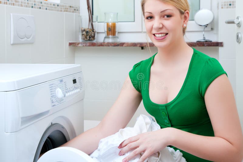 Woman Washing Clothes with Machine Stock Photo - Image of young, adult ...