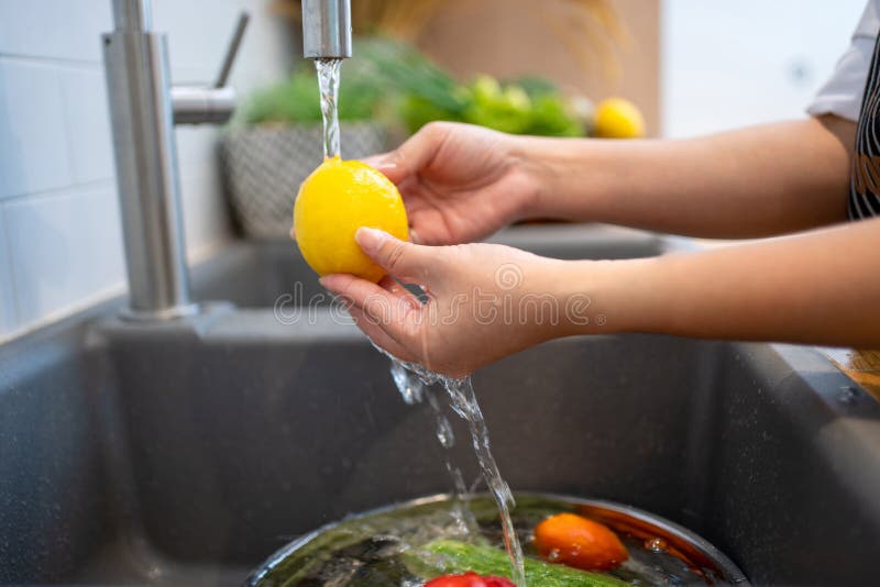 Woman Washing Fresh Lemon in Kitchen Sink, Closeup Stock Image - Image ...