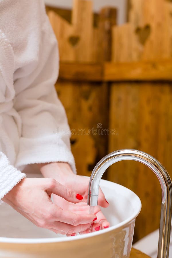 Woman washing hands at spa stock image. Image of caucasian - 44693183