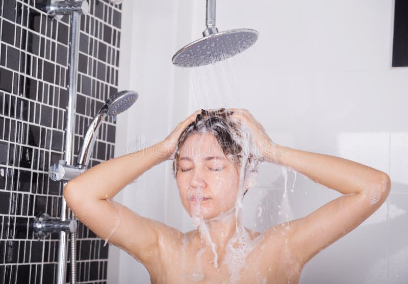 Woman Washing Head And Hair In The Rain Shower By Shampoo Stock Image