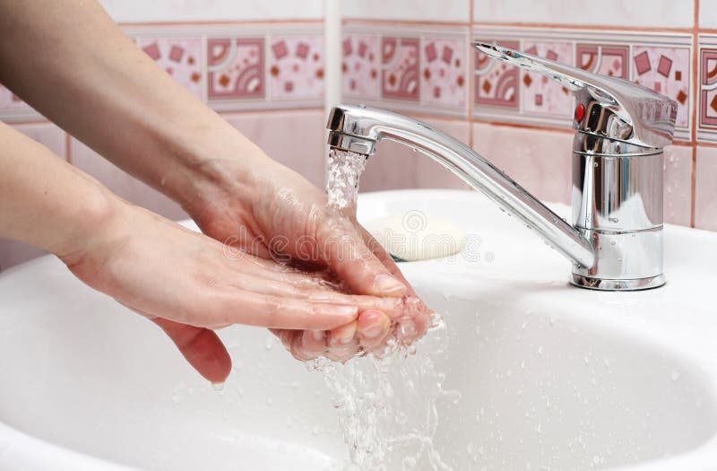 Woman washing her hands stock photo. Image of cold, spray - 18171084