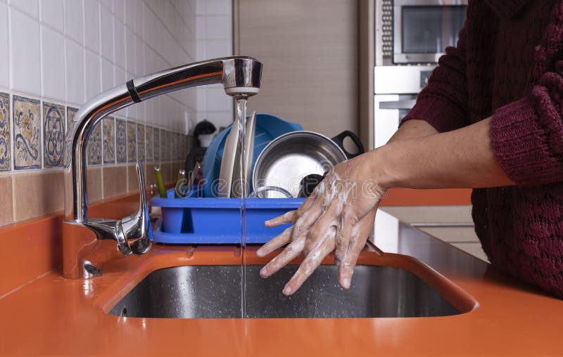 Woman Washing Her Hands in the Kitchen Stock Image - Image of domicile ...
