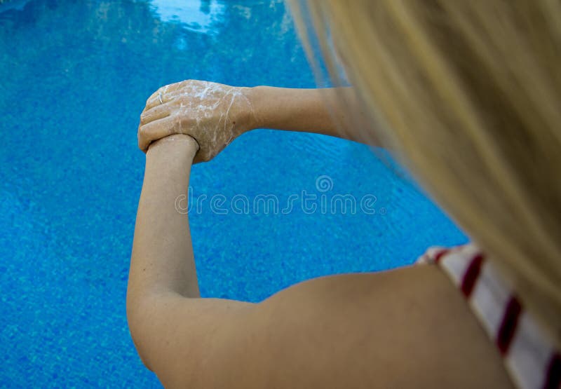 Woman Washing Her Hands Using Soap Above the Pool. Stock Image - Image ...