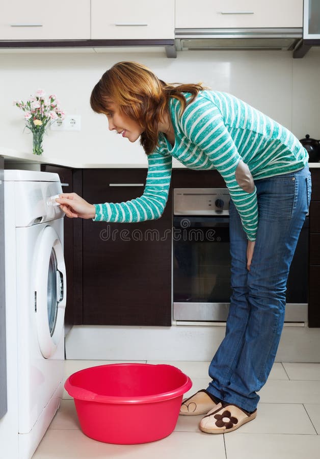 Woman with washing machine stock image. Image of housework - 38121345