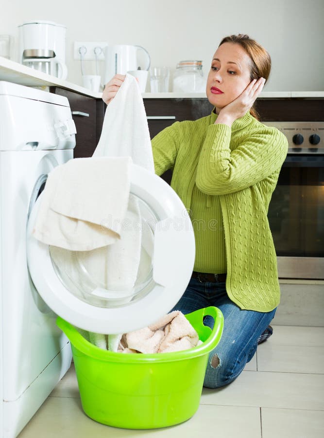 Woman with washing machine stock image. Image of appliance - 52407805