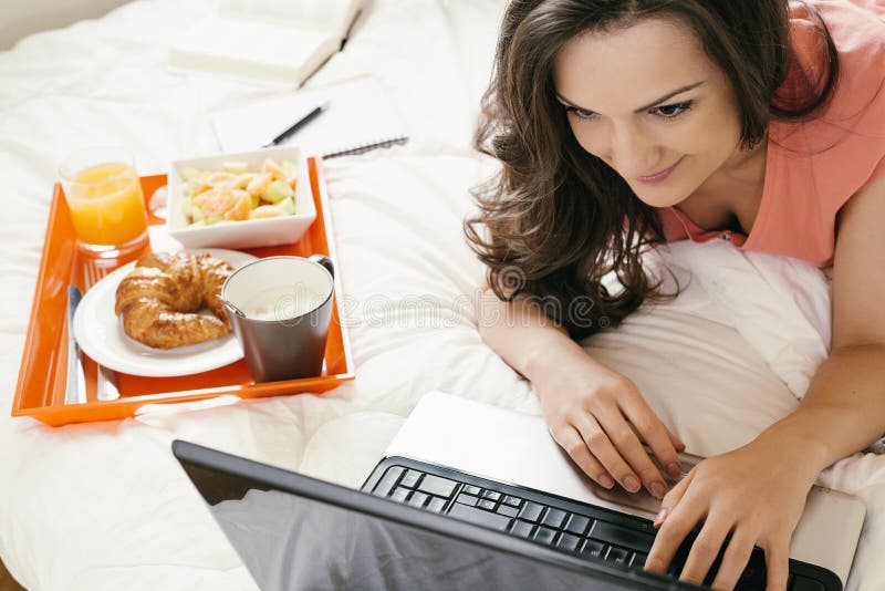 Woman Watching the Laptop Computer and Having Breakfast Stock Photo ...