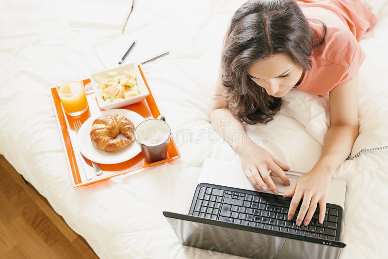 Woman Watching the Laptop Computer and Having Breakfast. Stock Image ...