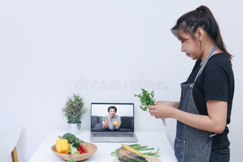 Woman Watching and Learn Online Cooking Courses in the Kitchen. Online ...