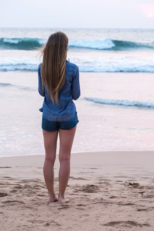 Woman watching the sunset stock image. Image of beauty - 117786185