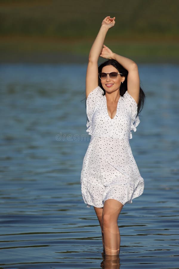 Young Woman in the Water in a Dress Stock Image - Image of happiness ...
