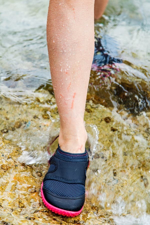 Woman in water shoe stock image. Image of limestone, rubber - 94552973
