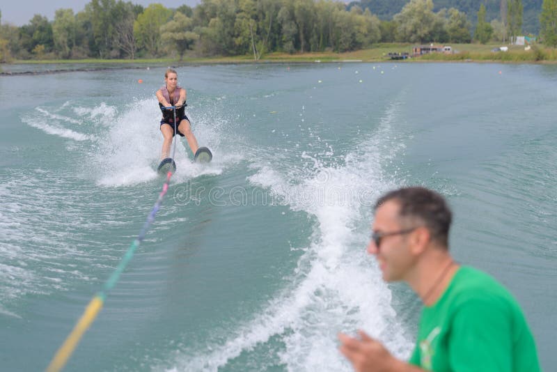 Woman water skiing on sea stock photo. Image of vacations - 99649022