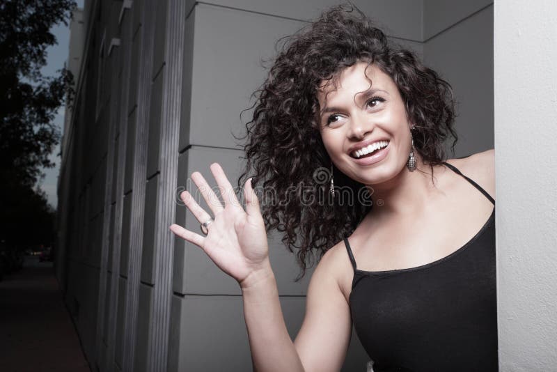 Woman waving with a smile stock image. Image of happy - 13905931