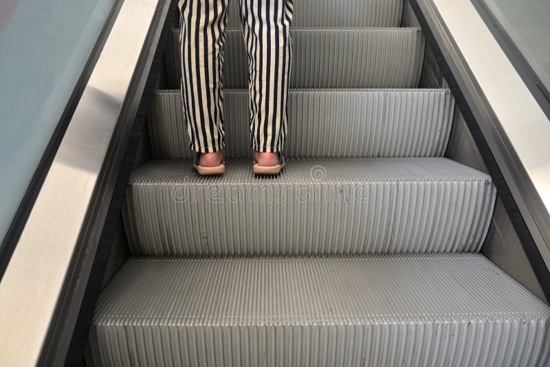Woman Wear Sandals Step Up on an Escalator Stock Photo - Image of woman ...