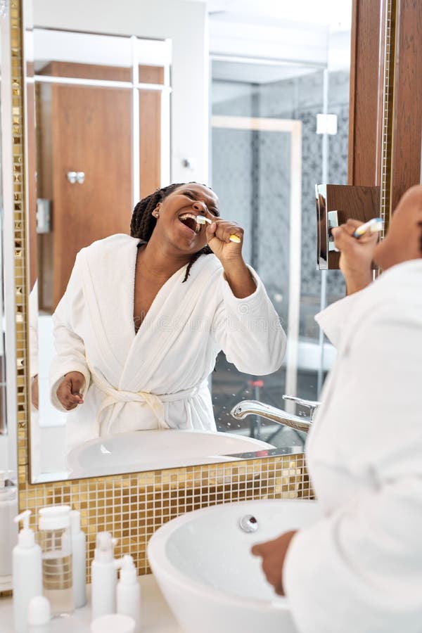 Woman Wearing Bathrobe Brushing Teeth in Bathroom, Dancing Singing ...