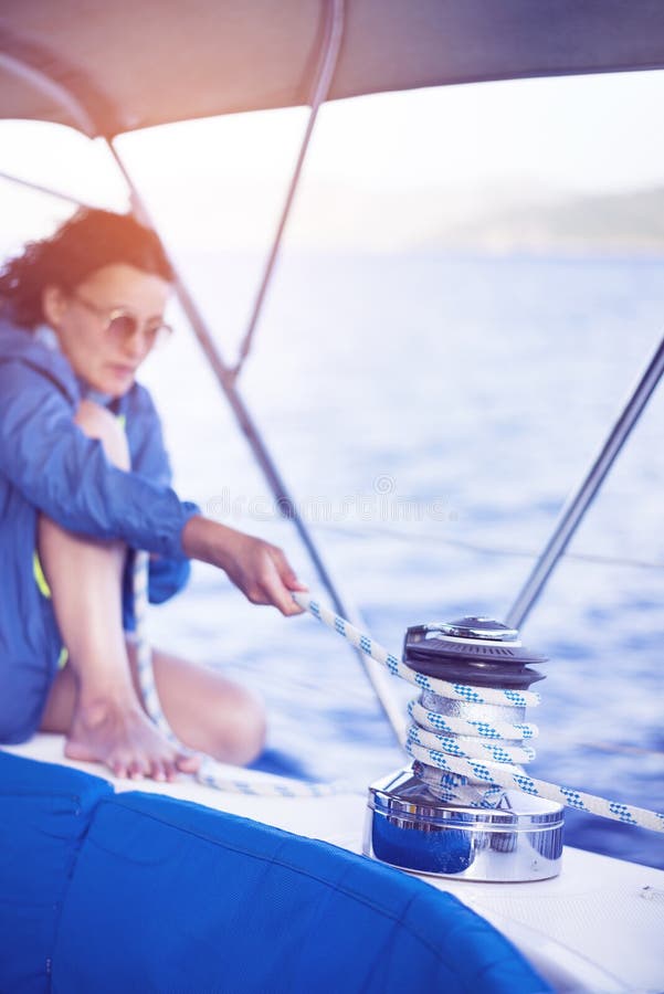 Woman Pulling the Ropes of Sailing Winch Stock Image - Image of ...