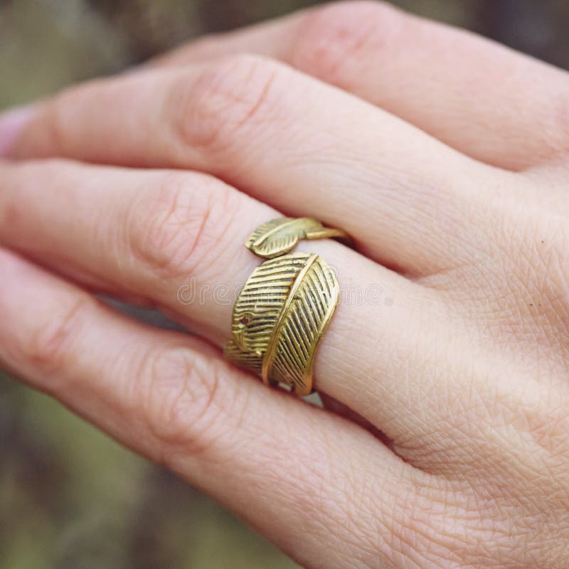 Woman wearing brass ring stock photo. Image of nature - 164470582