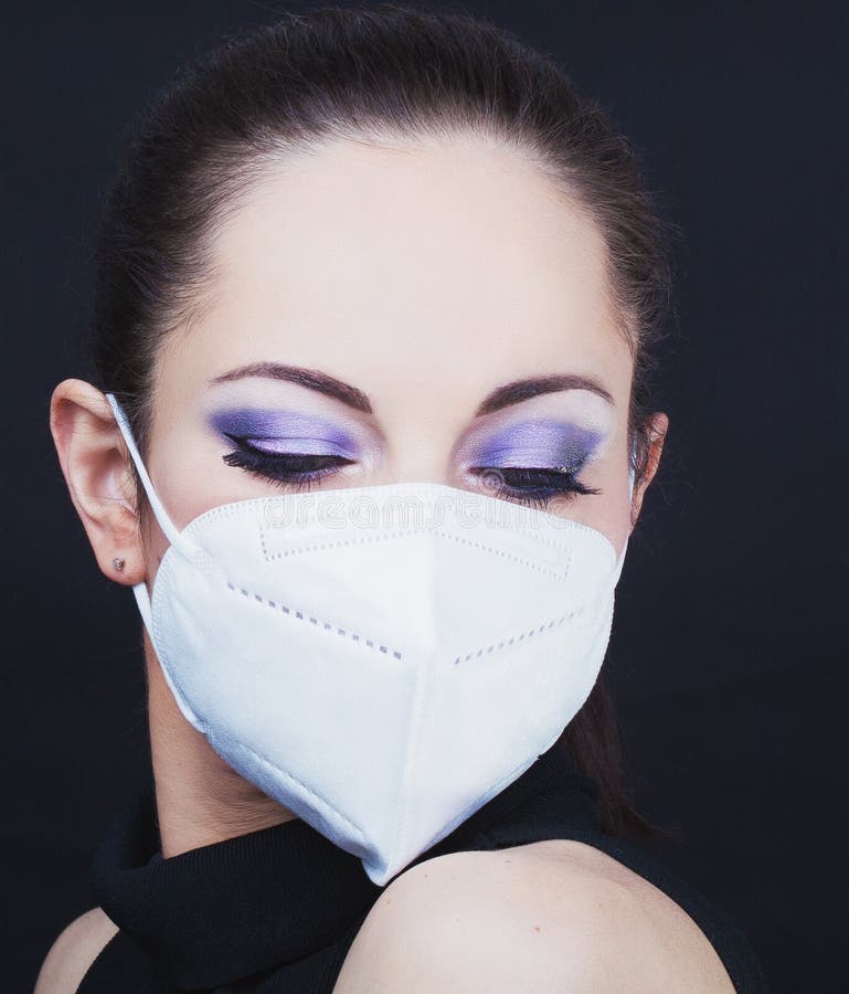 Woman wearing a face mask stock image. Image of isolated - 209266319