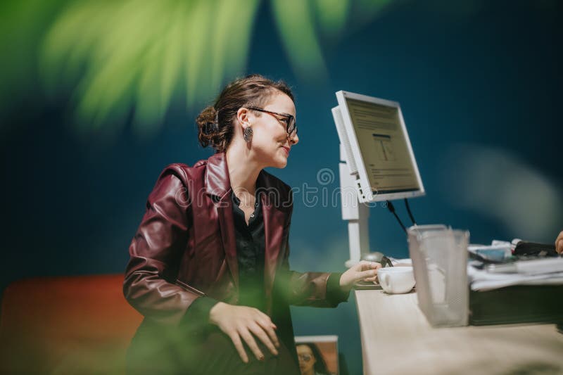 Professional Woman Working at Computer in a Modern Office Environment ...